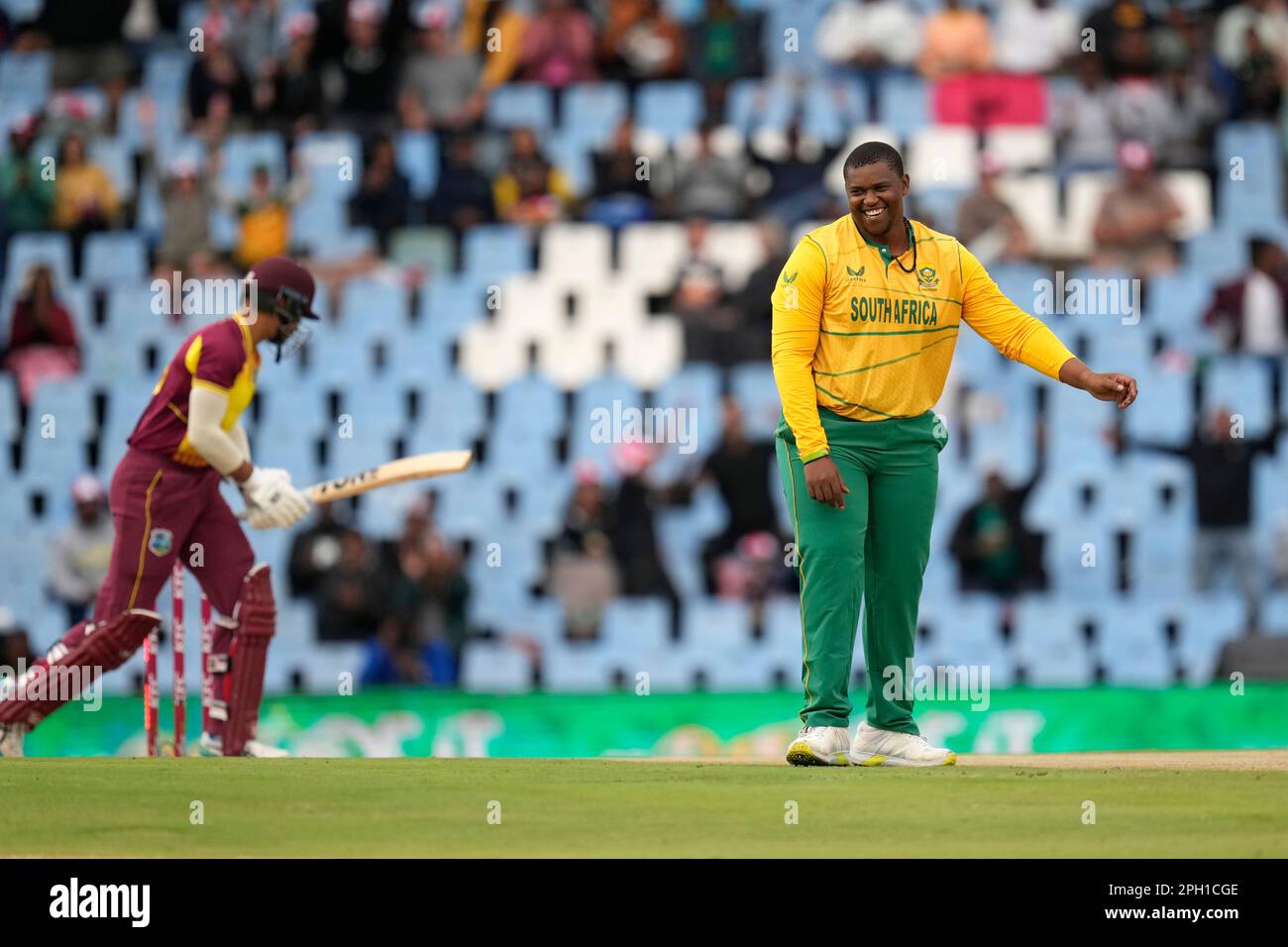 South Africa's bowler Sisanda Magala, right, celebrates after bowling ...