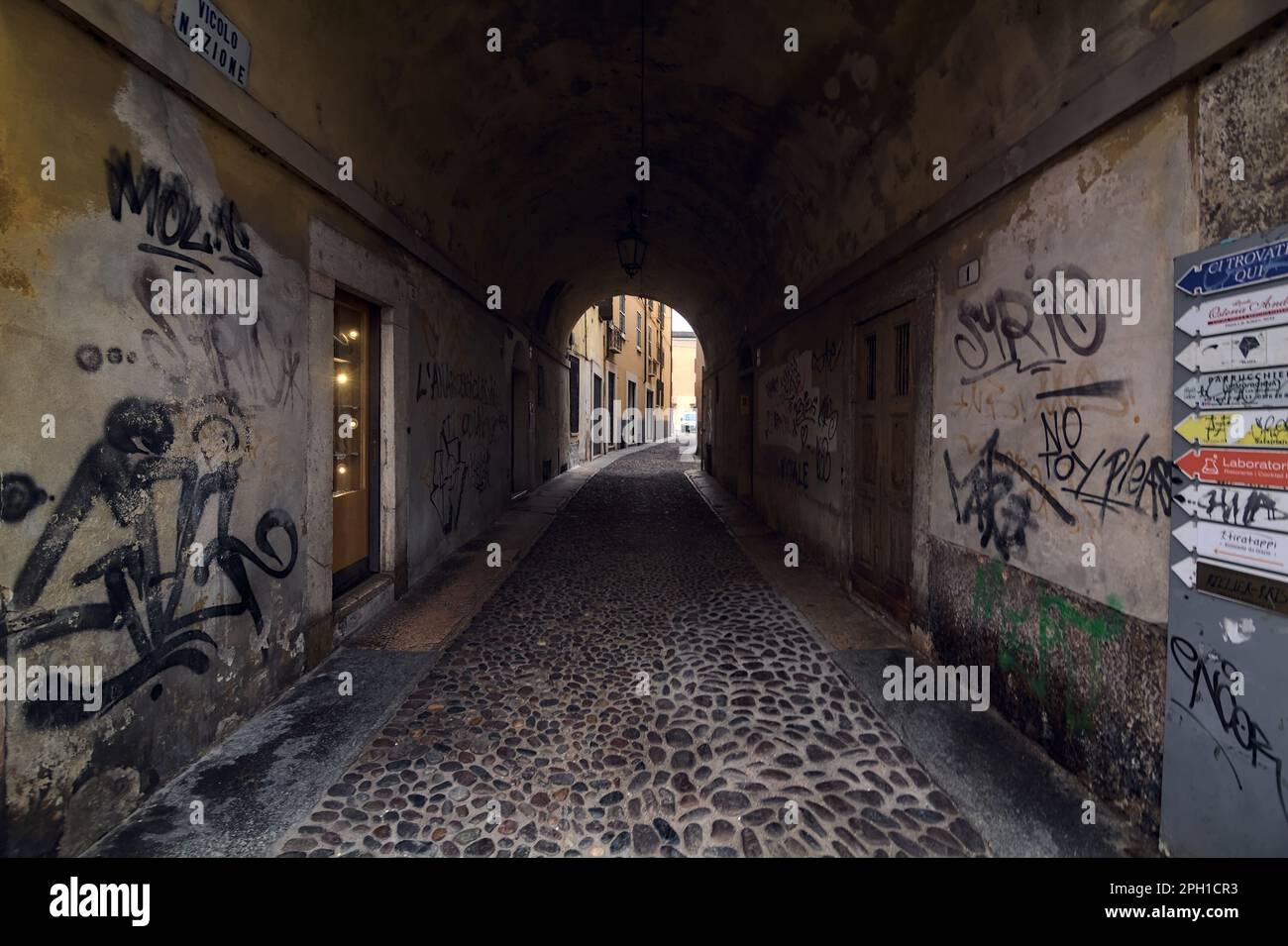 Covered alley in a historic building in an italian town Stock Photo - Alamy