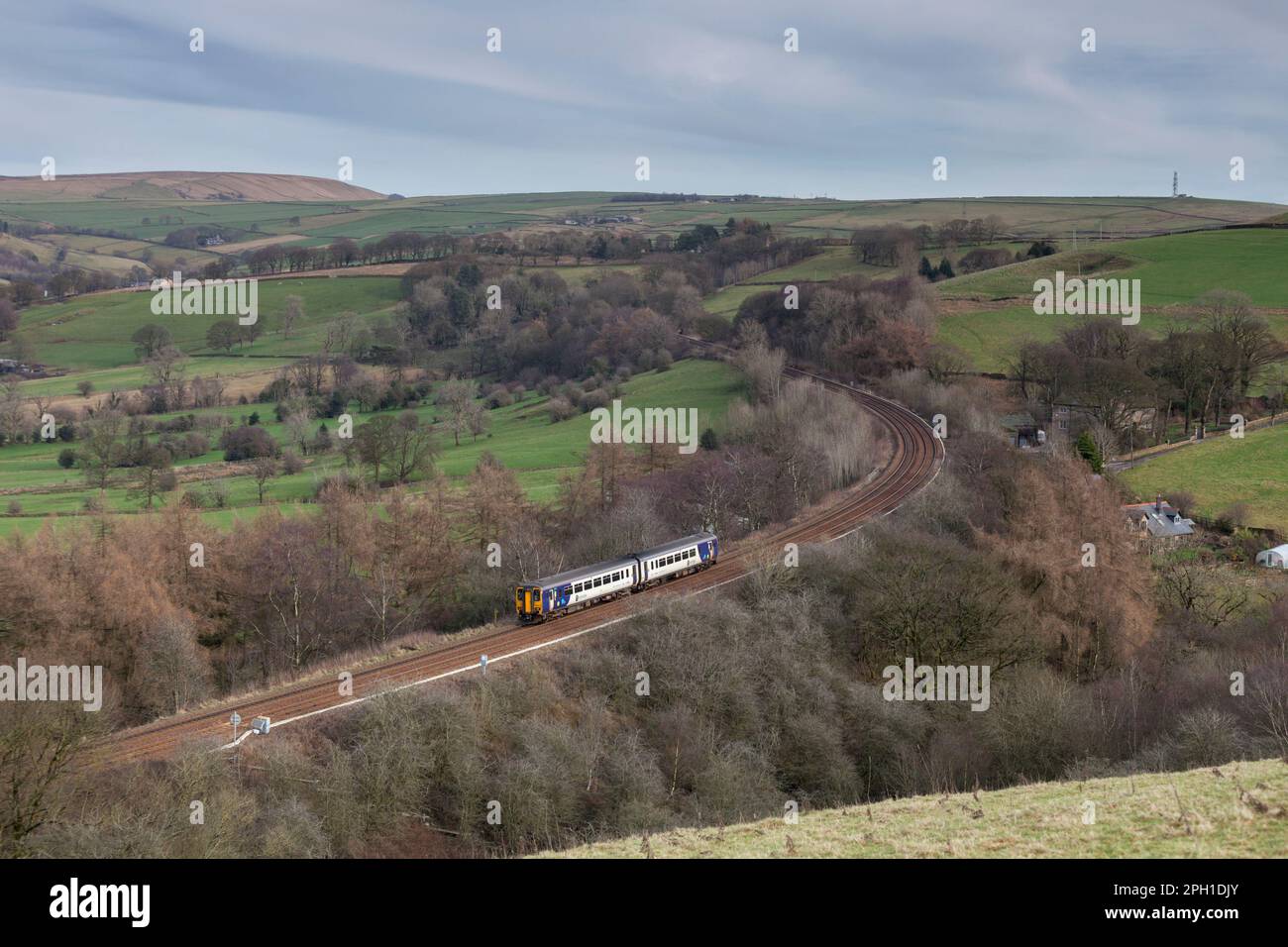 Northern Rail class 156 DMU train in the Derbyshire countryside passing ...