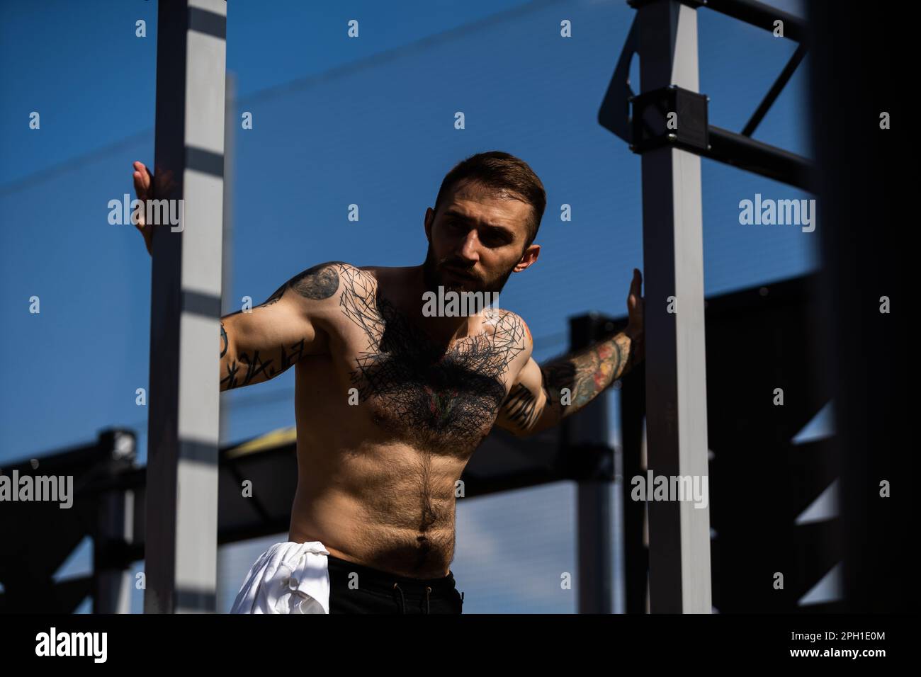 Man exercises on arm machine hi-res stock photography and images - Alamy