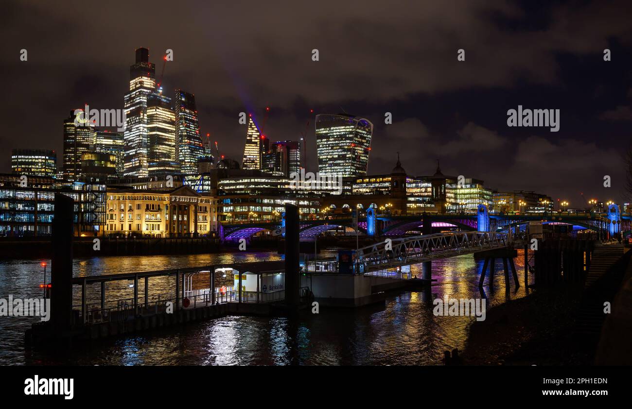 London, UK: Skyscrapers of the City of London at night with the River ...