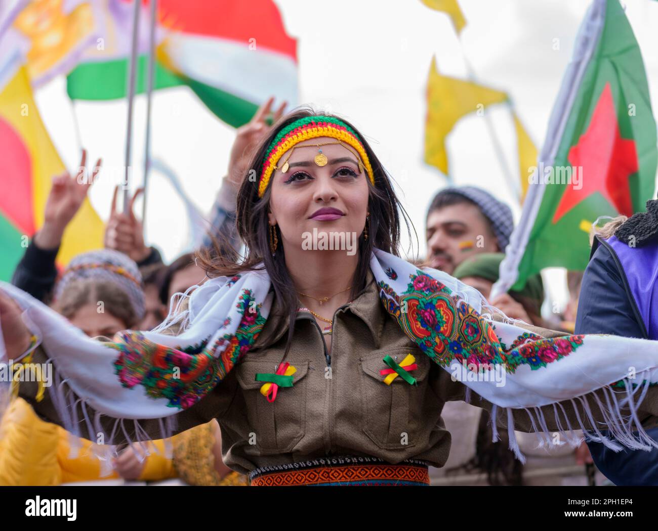 25 March 2023, Hesse, Frankfurt/Main: A woman dances to traditional ...