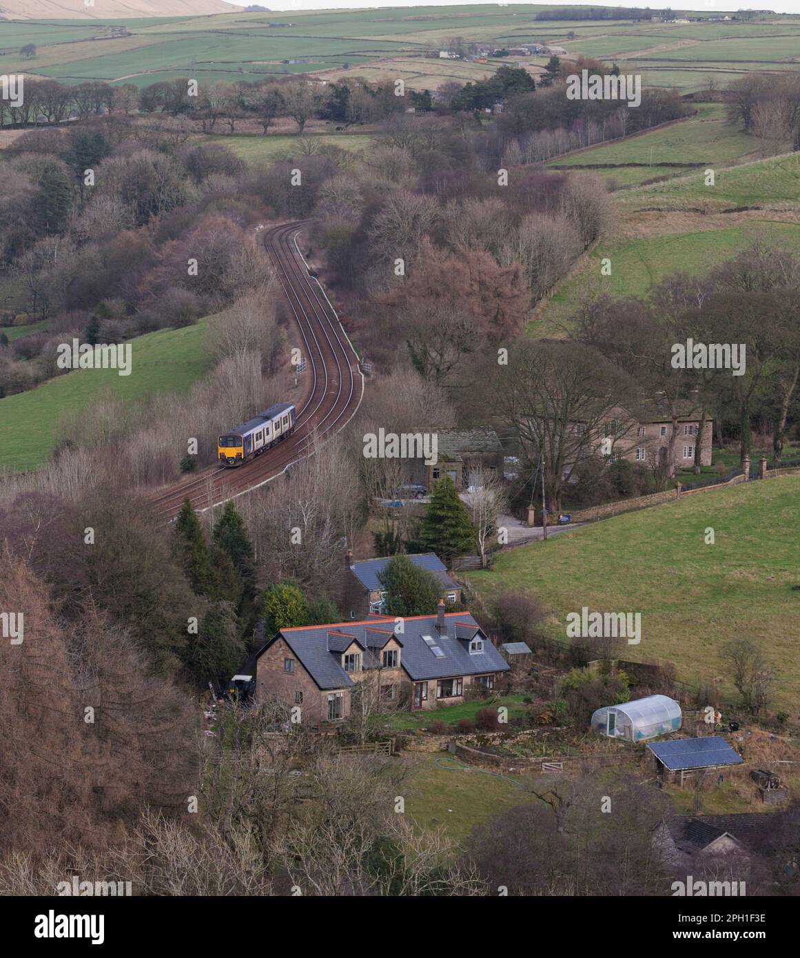 Northern Rail class 150 DMU train in the Derbyshire countryside passing ...