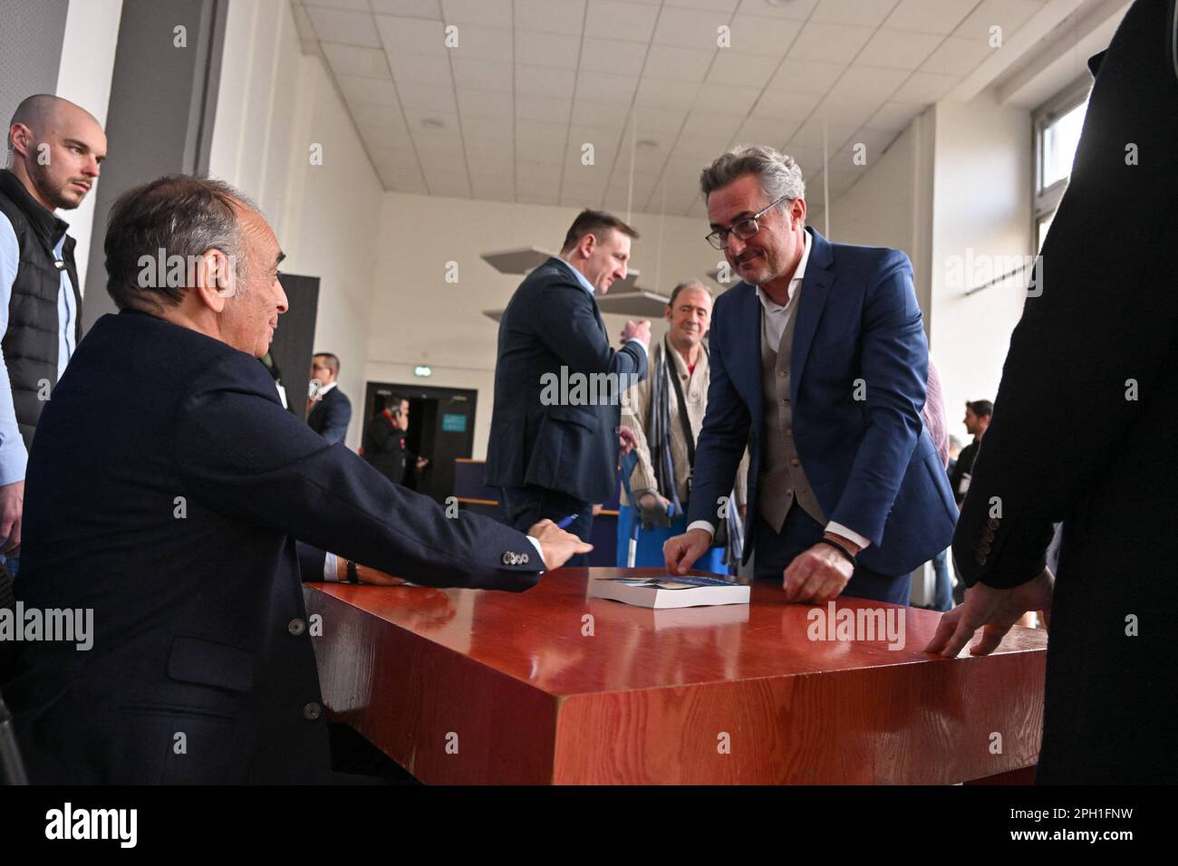Eric Zemmour, president of the far right party Reconquete, signs ...