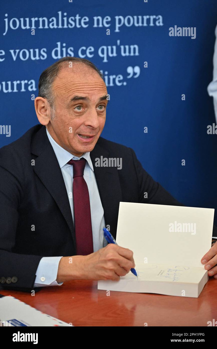Eric Zemmour, president of the far right party Reconquete, signs ...