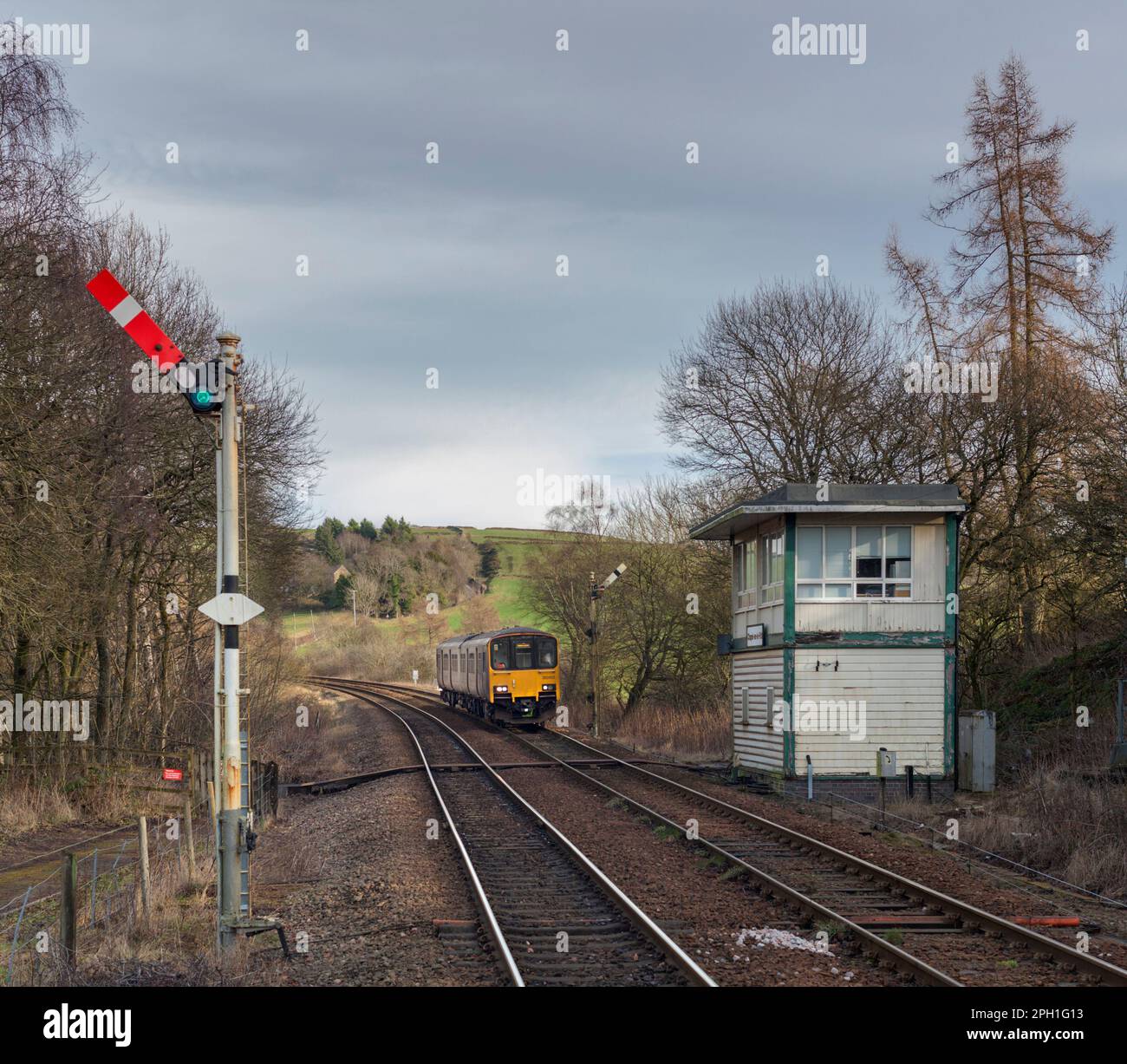 Northern Rail class 150 Diesel multiple unit train 150102 passing the mechanical signal box and ...