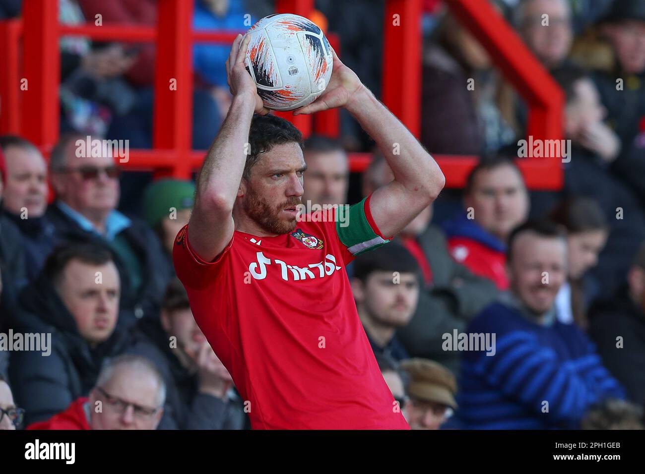 Ben Tozer #4 of Wrexham gets ready to take a throw in during the ...