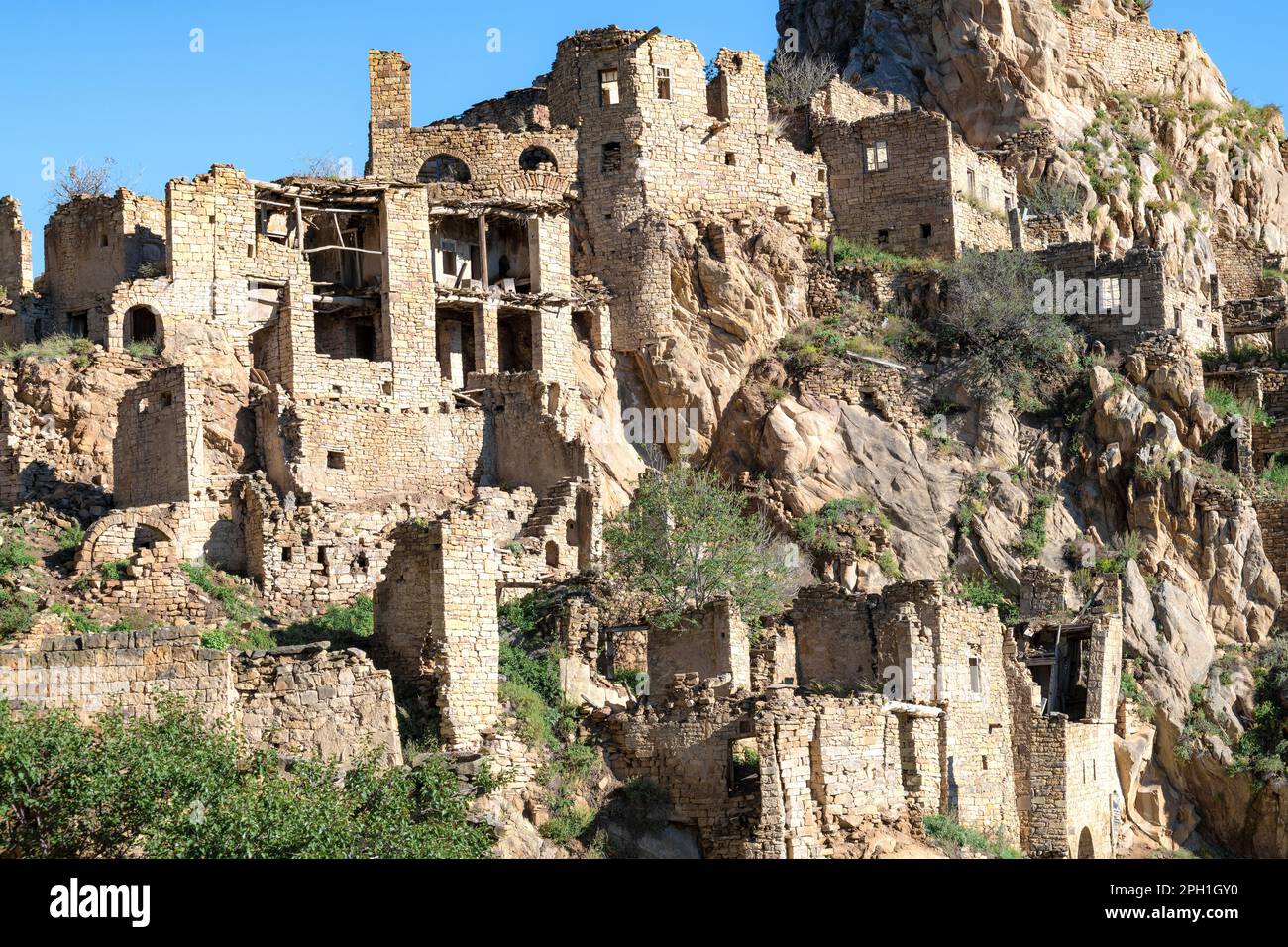 On the ruins of the old abandoned village of Gamsutl on a sunny ...