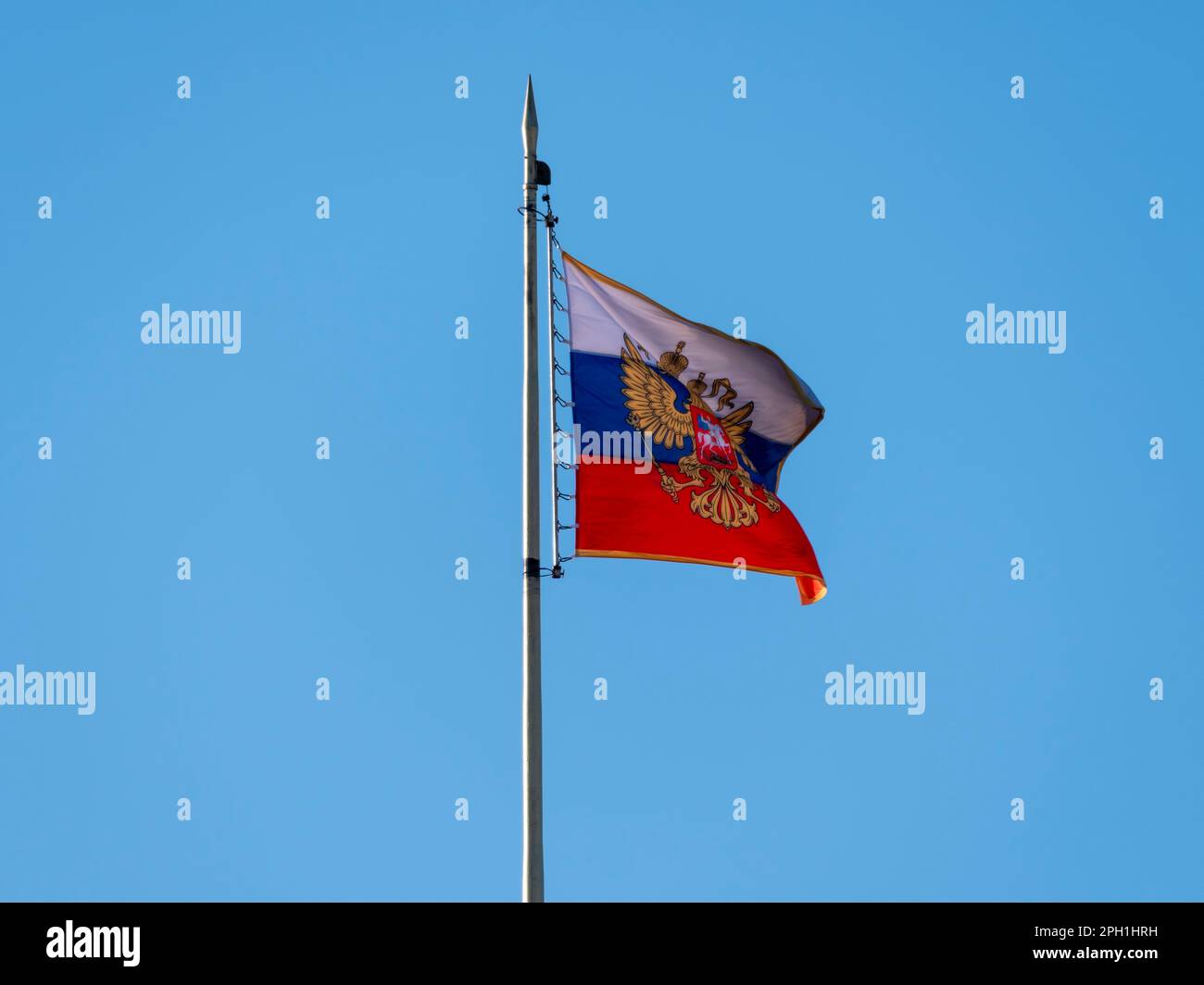 Russian flag fluttering in the wind on a flagpole Stock Photo - Alamy
