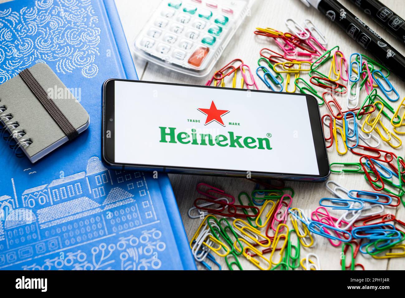 In this photo illustration a Heineken logo seen displayed on a ...