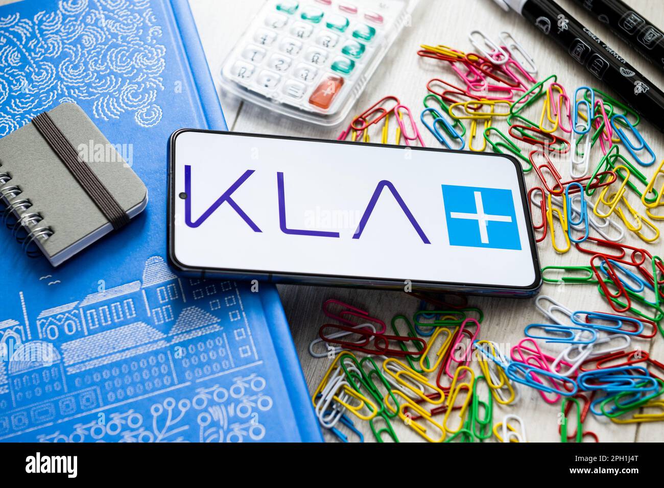 In this photo illustration a KLA+ logo seen displayed on a smartphone ...
