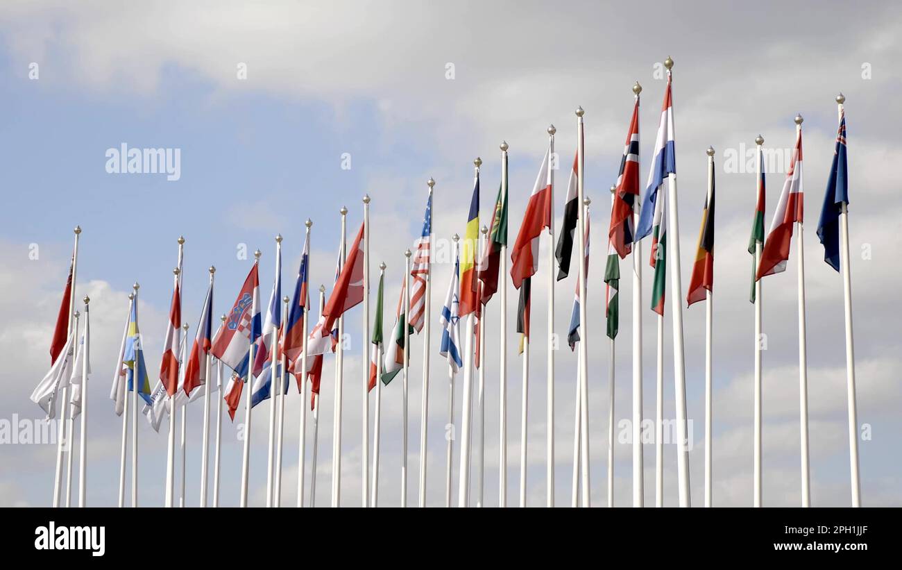 Various national flags with the EU flag under a blue sky Stock Photo ...