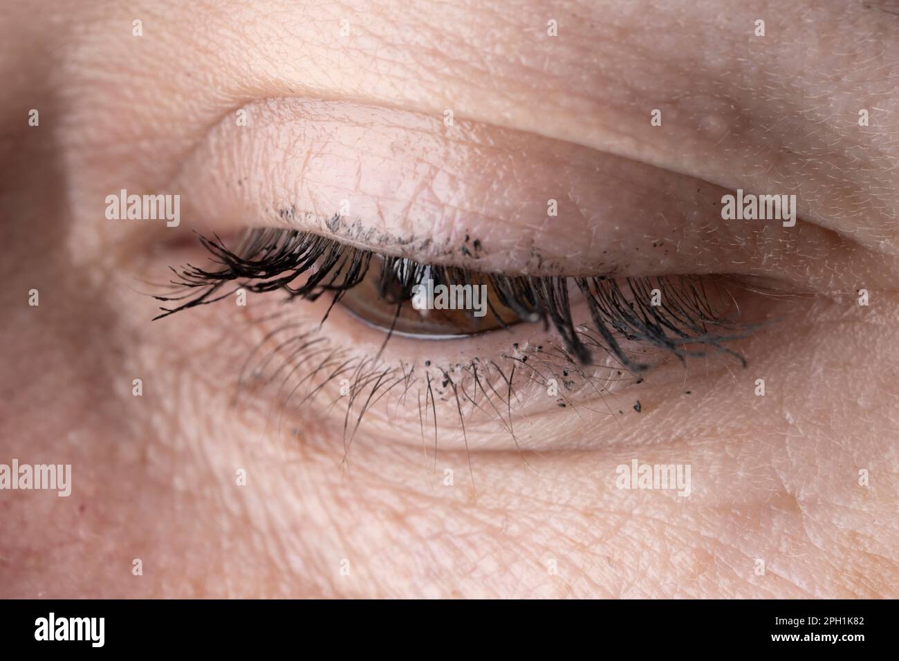 half-closed female eye with painted eyelashes Stock Photo - Alamy