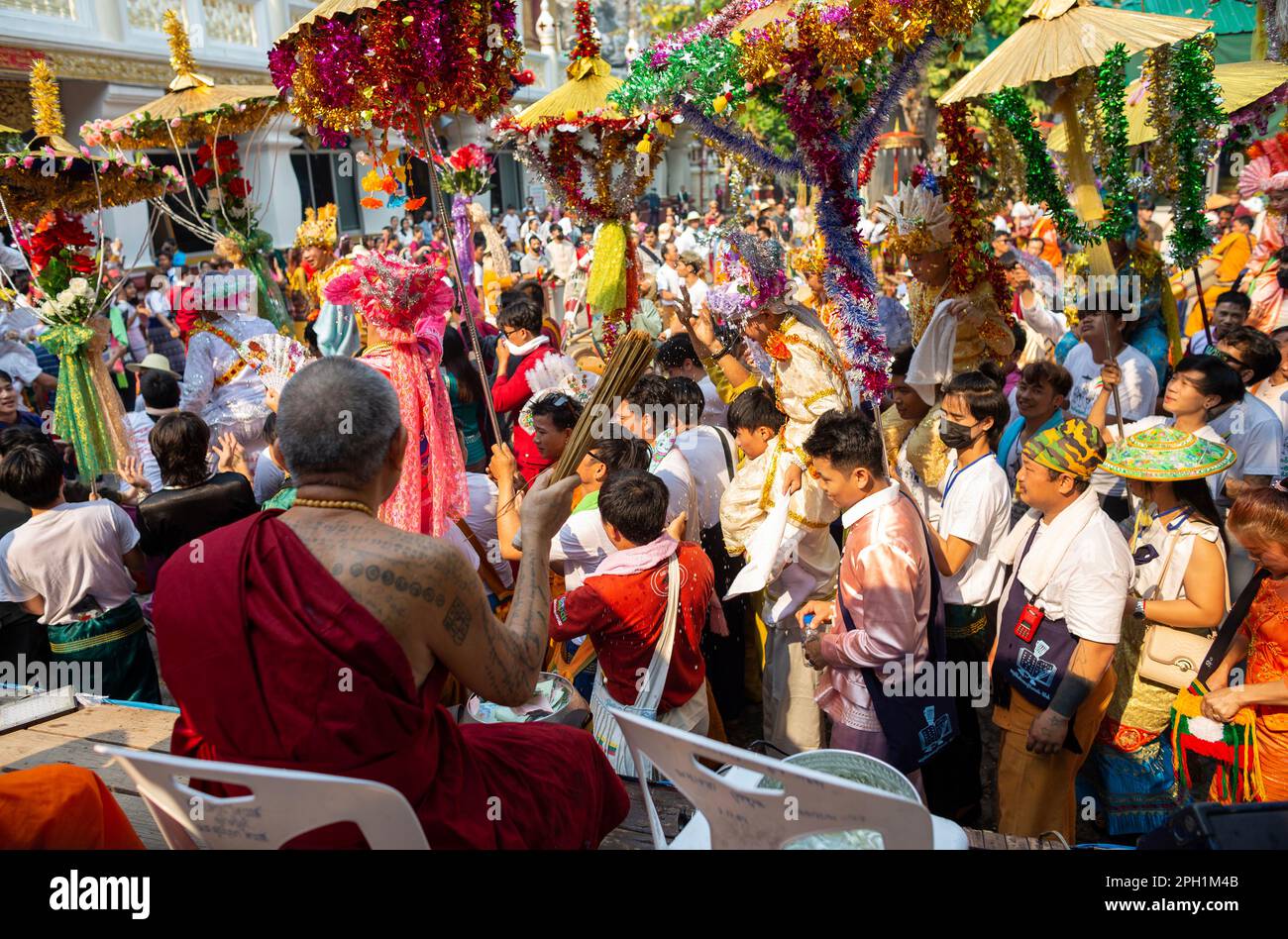 A Thai Buddhist monk splashes holy water on young ethnic Shan boys ...