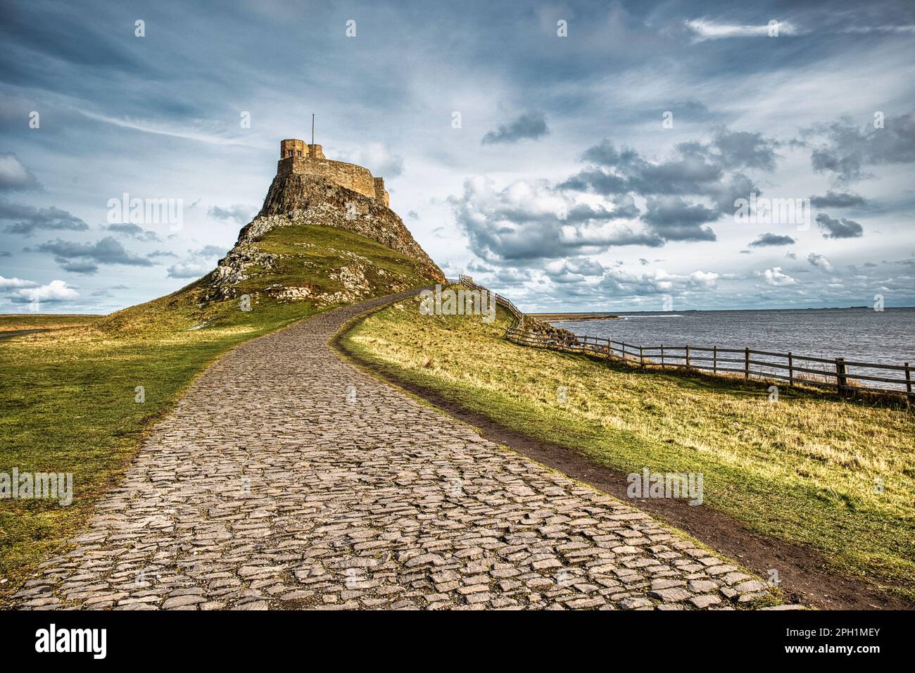 Cobbled path to the castle with snow clouds starting to gather Stock ...