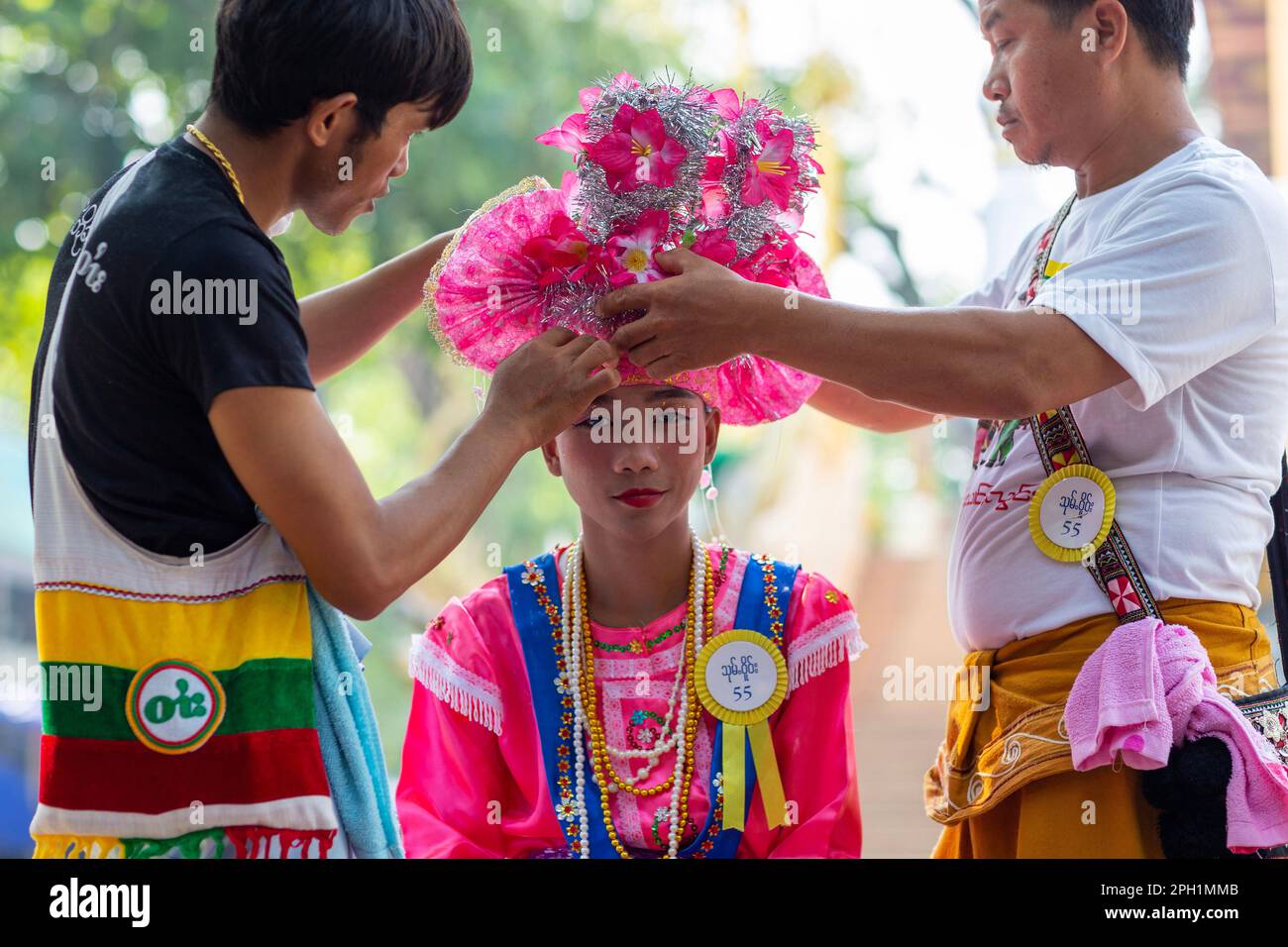 A young ethnic Shan boy seen getting dressed with colorful costume ...