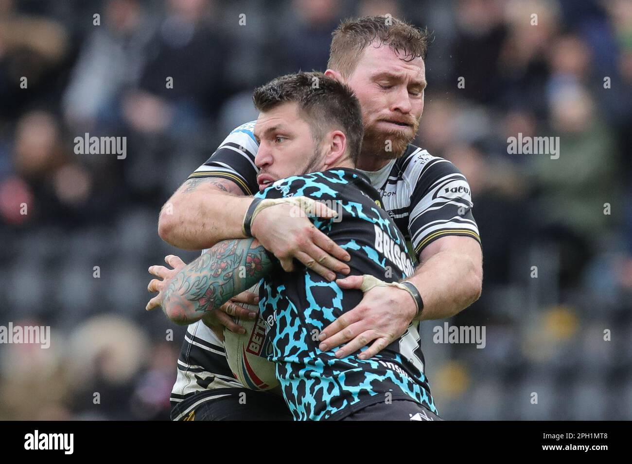 Scott Taylor #30 of Hull FC tackles Tom Briscoe #2 of Leigh Leopards ...