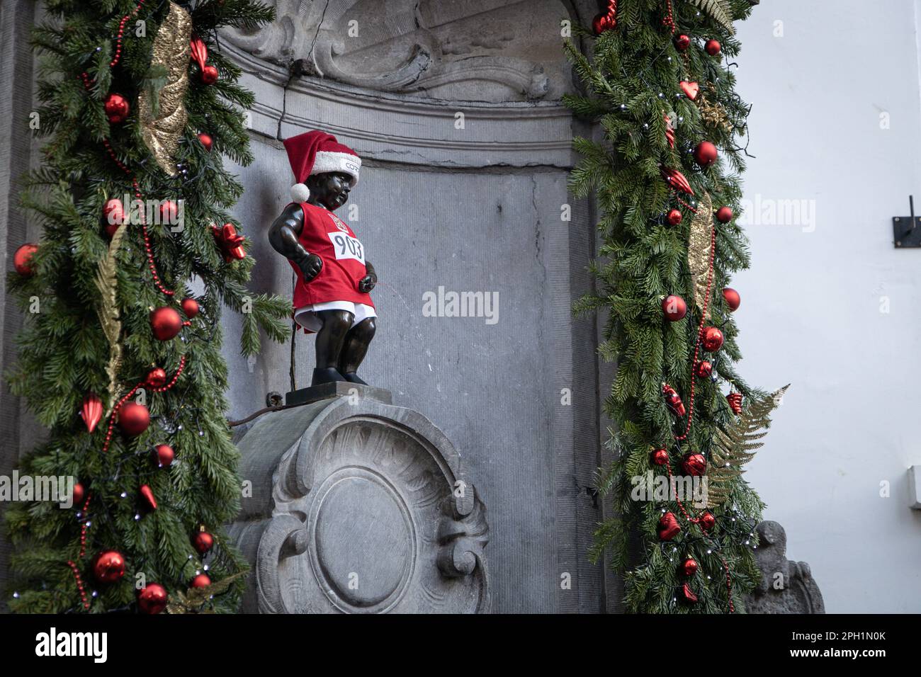 BRUSSELS, BELGIUM-DECEMBER 26, 2022: Manneken Pis (pissing boy, peeing ...