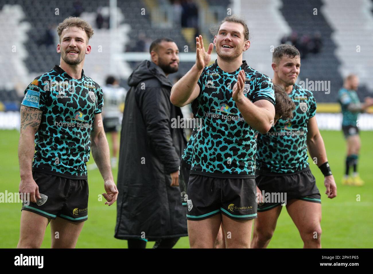 The Leigh Leopards team celebrate the win in front of their travelling ...