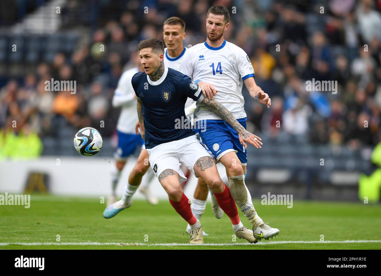 Glasgow, UK. 25th Mar, 2023. Lydon Dykes of Scotland and Valentin ...
