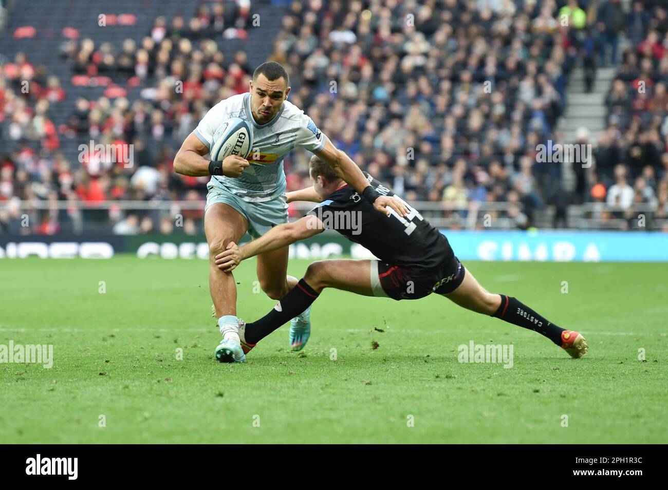 London, UK. 25th Mar, 2023. Joe Marchant of Harlequins is tackled by ...