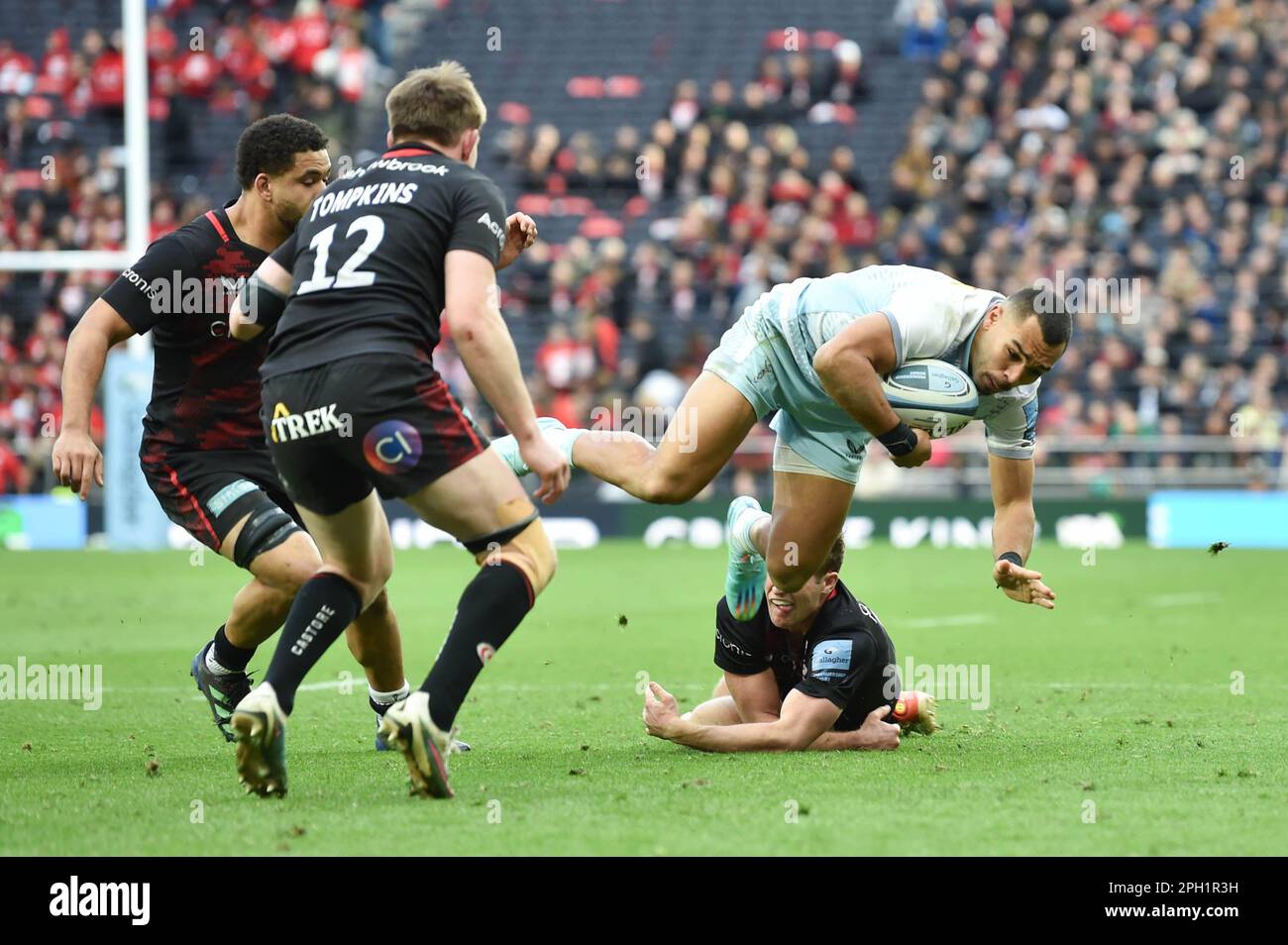 London, UK. 25th Mar, 2023. Joe Marchant of Harlequins is tackled by ...