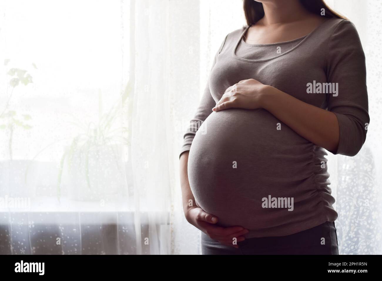 Pregnant Woman With Big Belly At Window Maternity Prenatal Care And