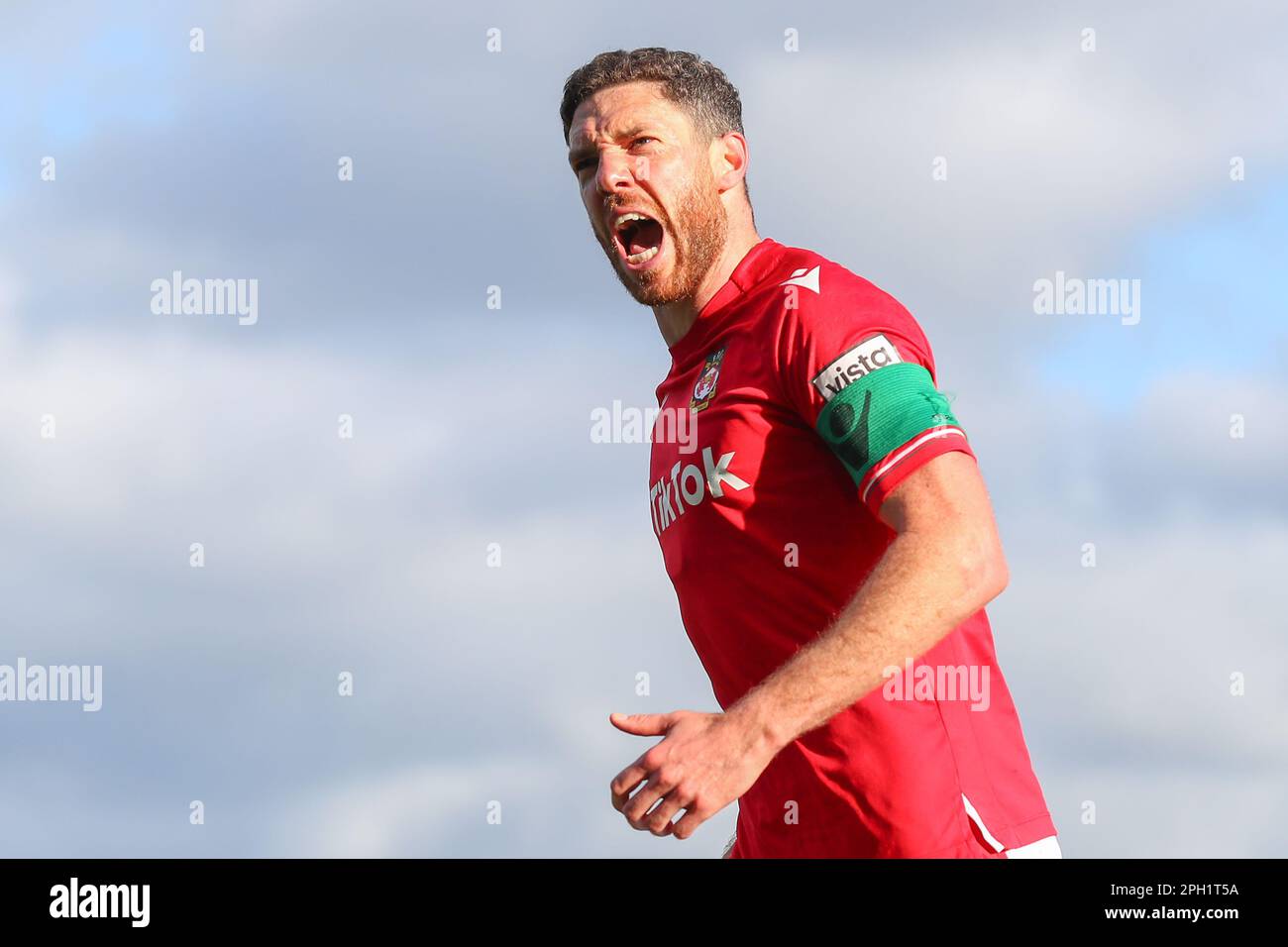 Wrexham, UK. 25th Mar, 2023. Ben Tozer #4 of Wrexham interacts with the ...