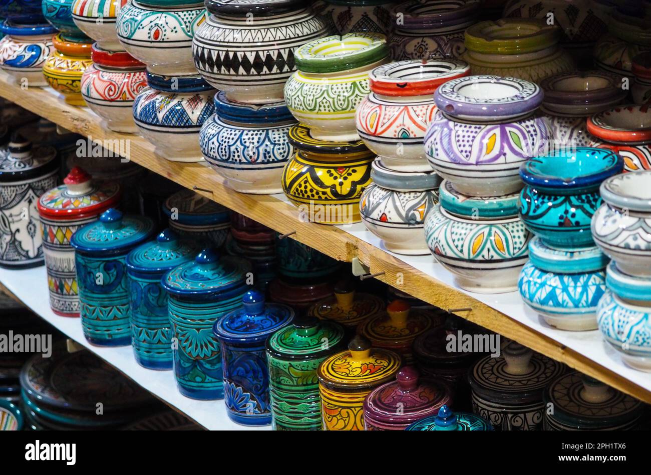 Handmade colourful decorated bowls or cups on display at traditional ...