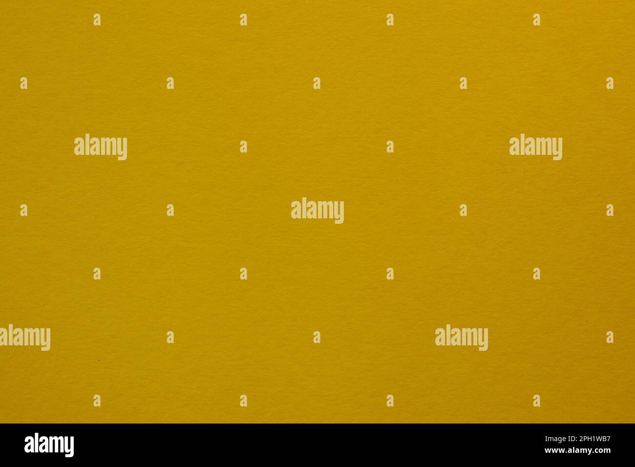 Mustard yellow colored tinted paper sheet background Stock Photo - Alamy