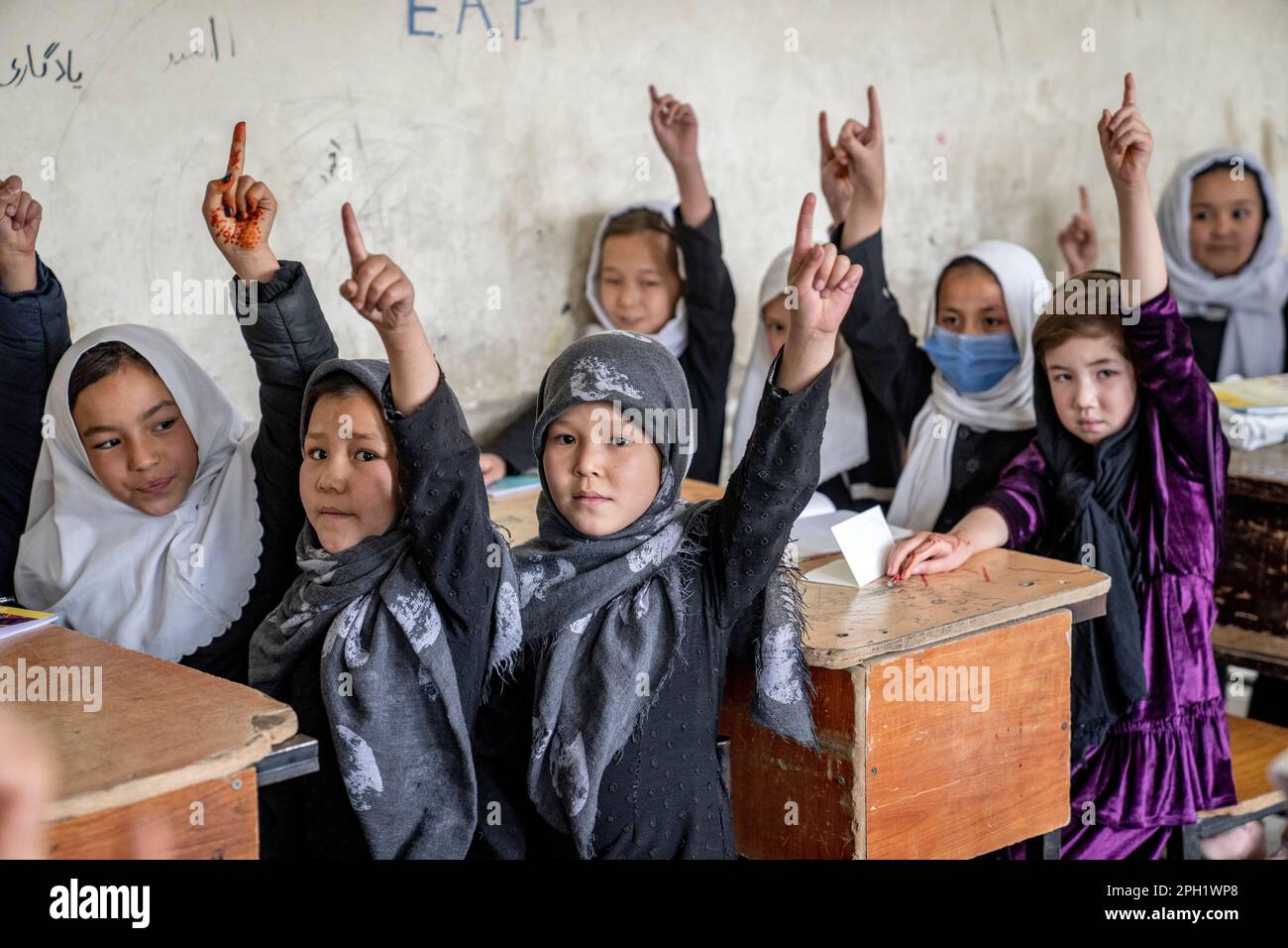 Afghan school girls attend their classroom on the first day of the new ...