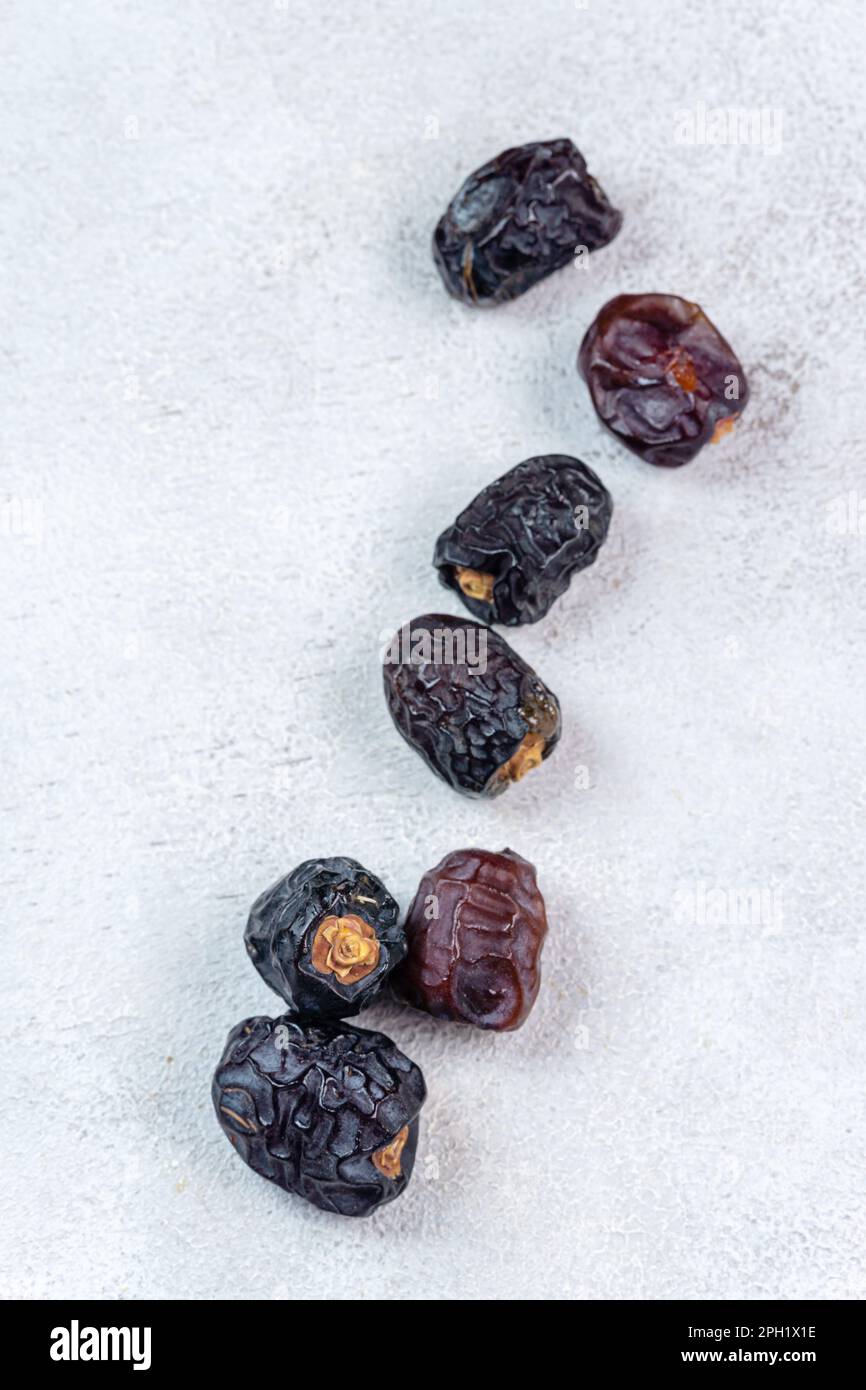 Raw Organic Arabic Dates, Ajwa Dates on light gray background. Ramadan ...