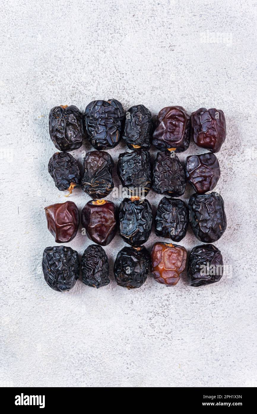 Raw Organic Arabic Dates, Ajwa Dates on light gray background. Ramadan ...