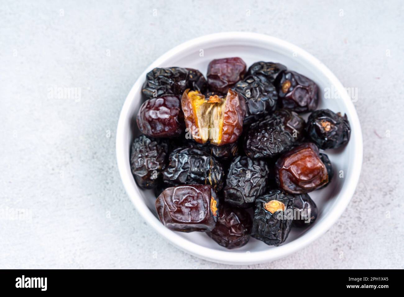 Raw Organic Arabic Dates, Ajwa Dates on light gray background. Ramadan ...
