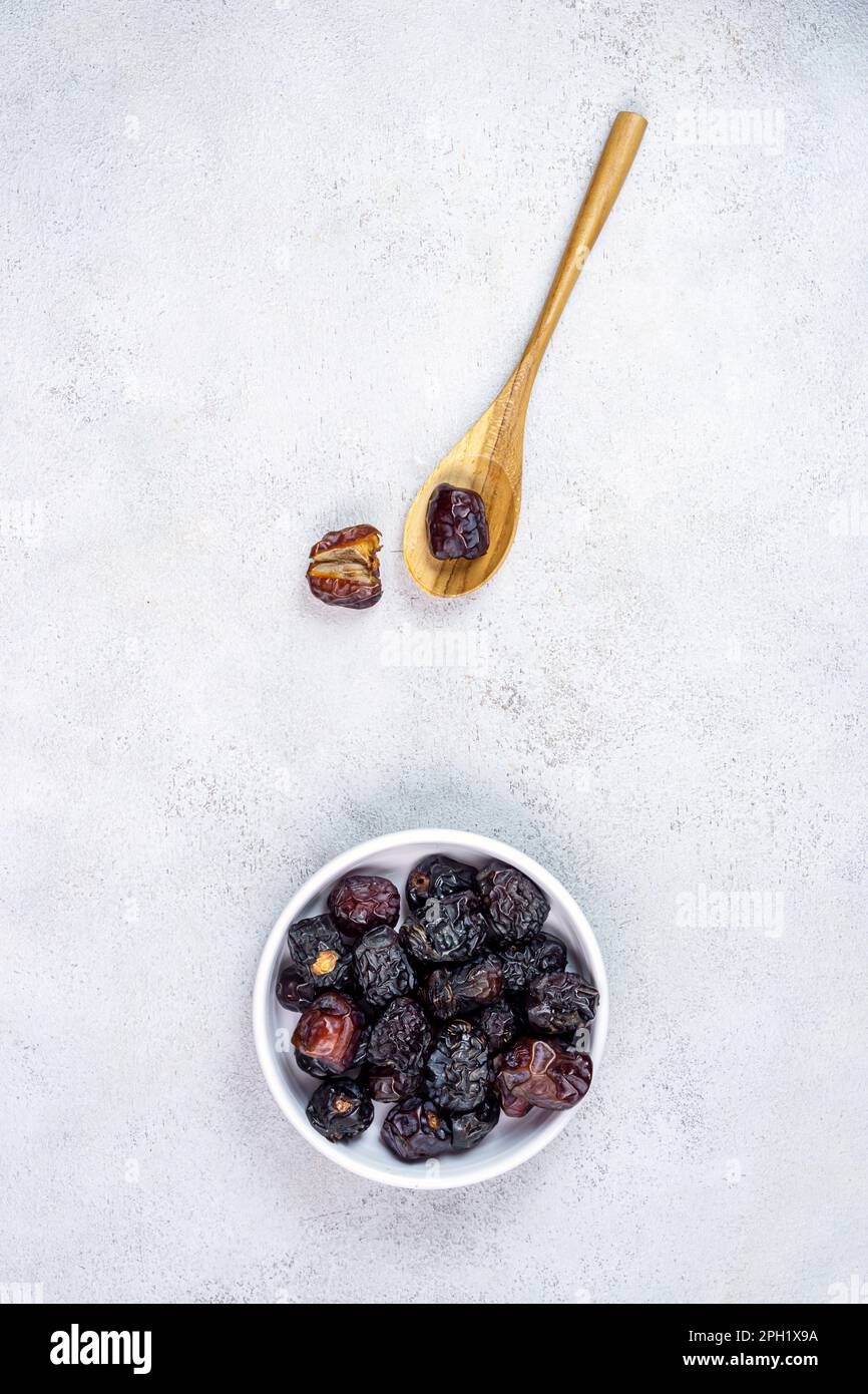 Raw Organic Arabic Dates, Ajwa Dates on light gray background. Ramadan ...