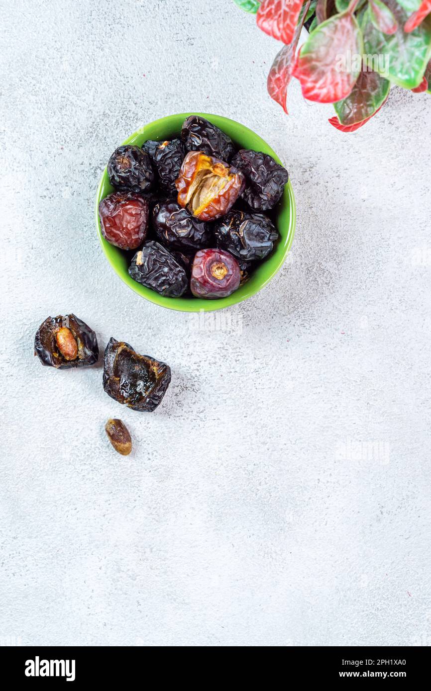 Raw Organic Arabic Dates, Ajwa Dates on light gray background. Ramadan ...