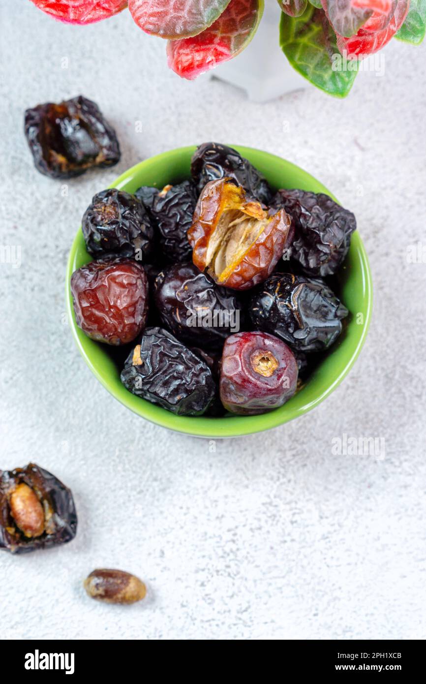 Raw Organic Arabic Dates, Ajwa Dates on light gray background. Ramadan ...