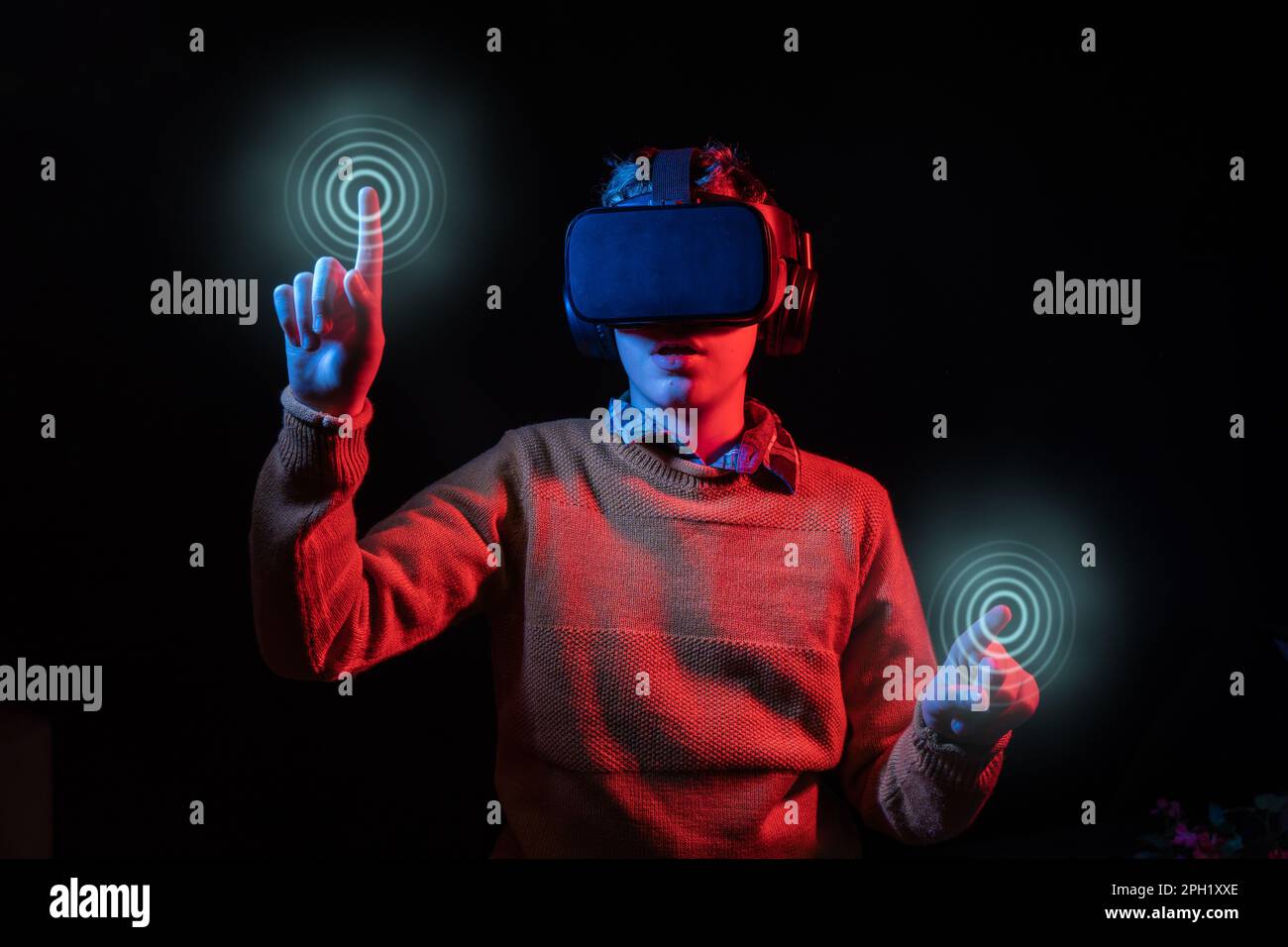 Man wearing a VR headset, pressing virtual points with both index ...