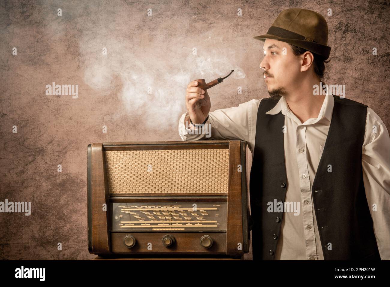 pipe man with an old radio Stock Photo - Alamy