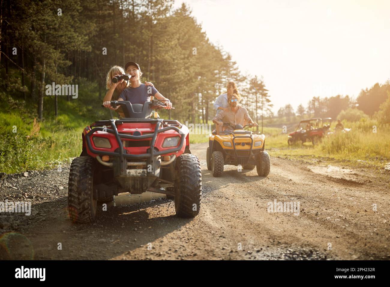 Group of avanturistic friends driving quads in the nature Stock Photo ...