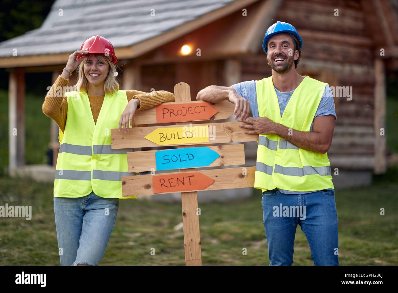 Builders are posing for a photo at cottage construction site in the ...
