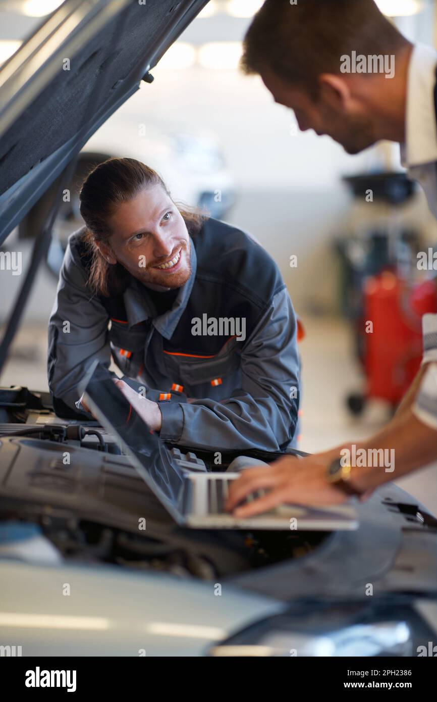 Car repair workers work hi-res stock photography and images - Alamy