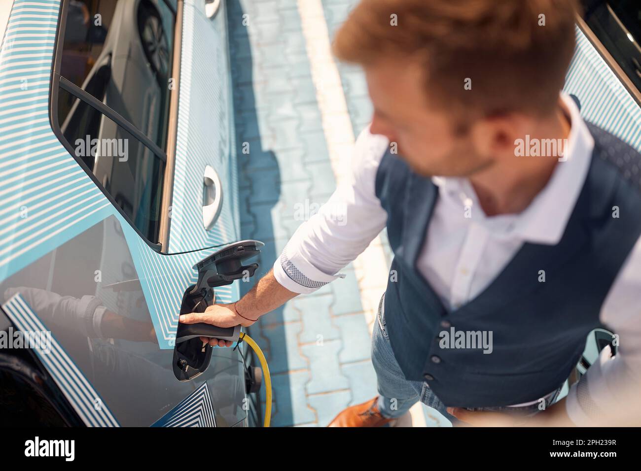 Top view of man car refueling on gas station Stock Photo - Alamy