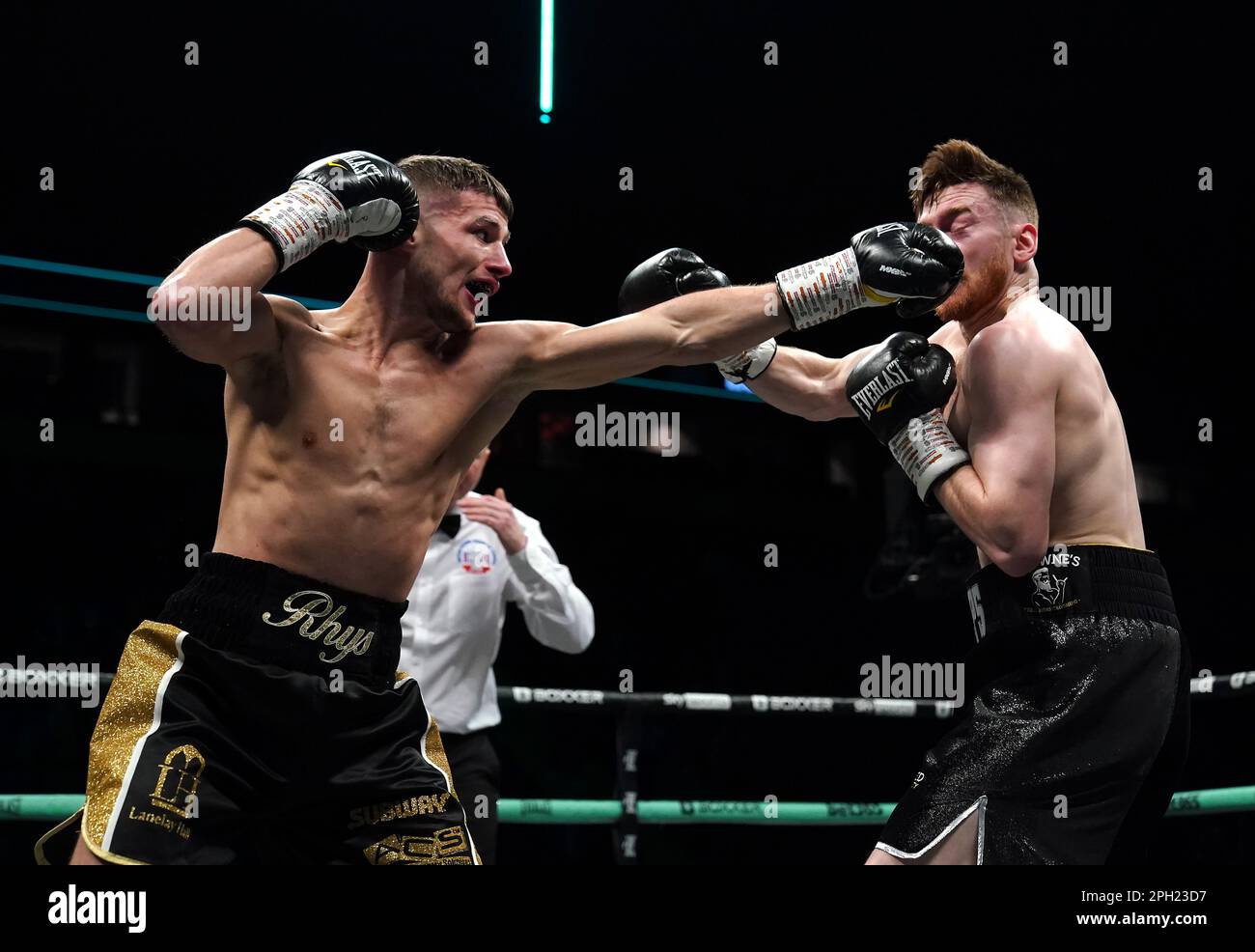 Rhys Edwards (left) and Brian Phillips in the super featherweight bout ...