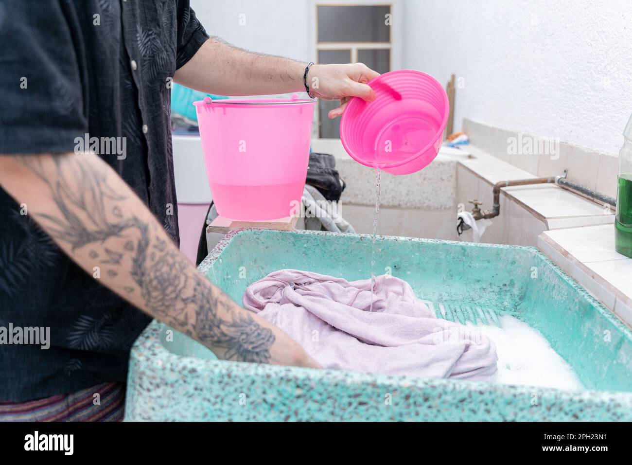 Washing Clothes By Hand In Sink