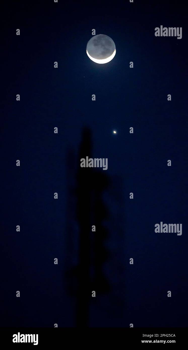 The crescent moon appears in the sky of Gaza, on the third day of the ...