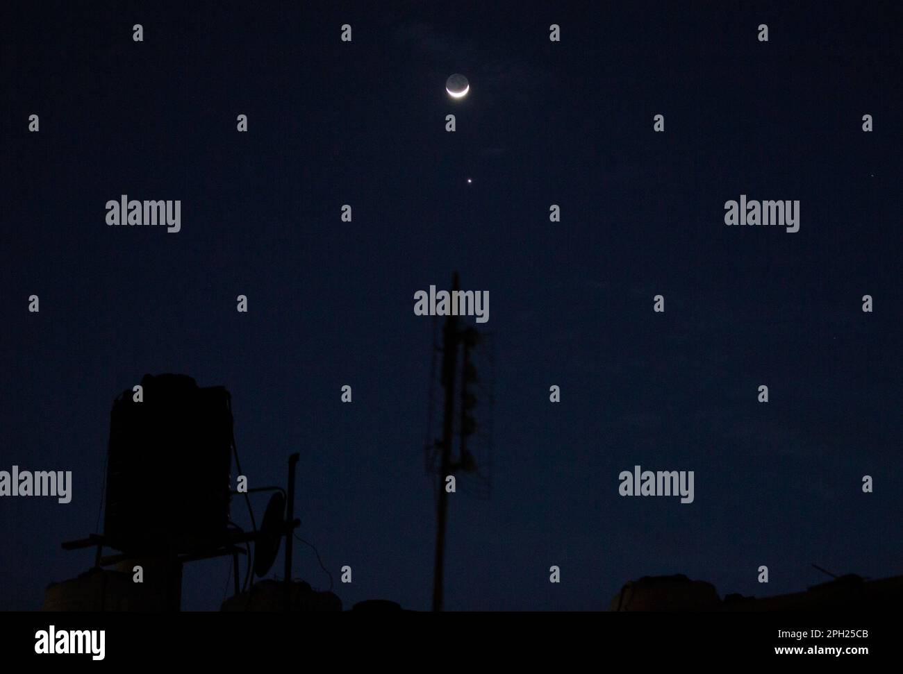 The crescent moon appears in the sky of Gaza, on the third day of the ...