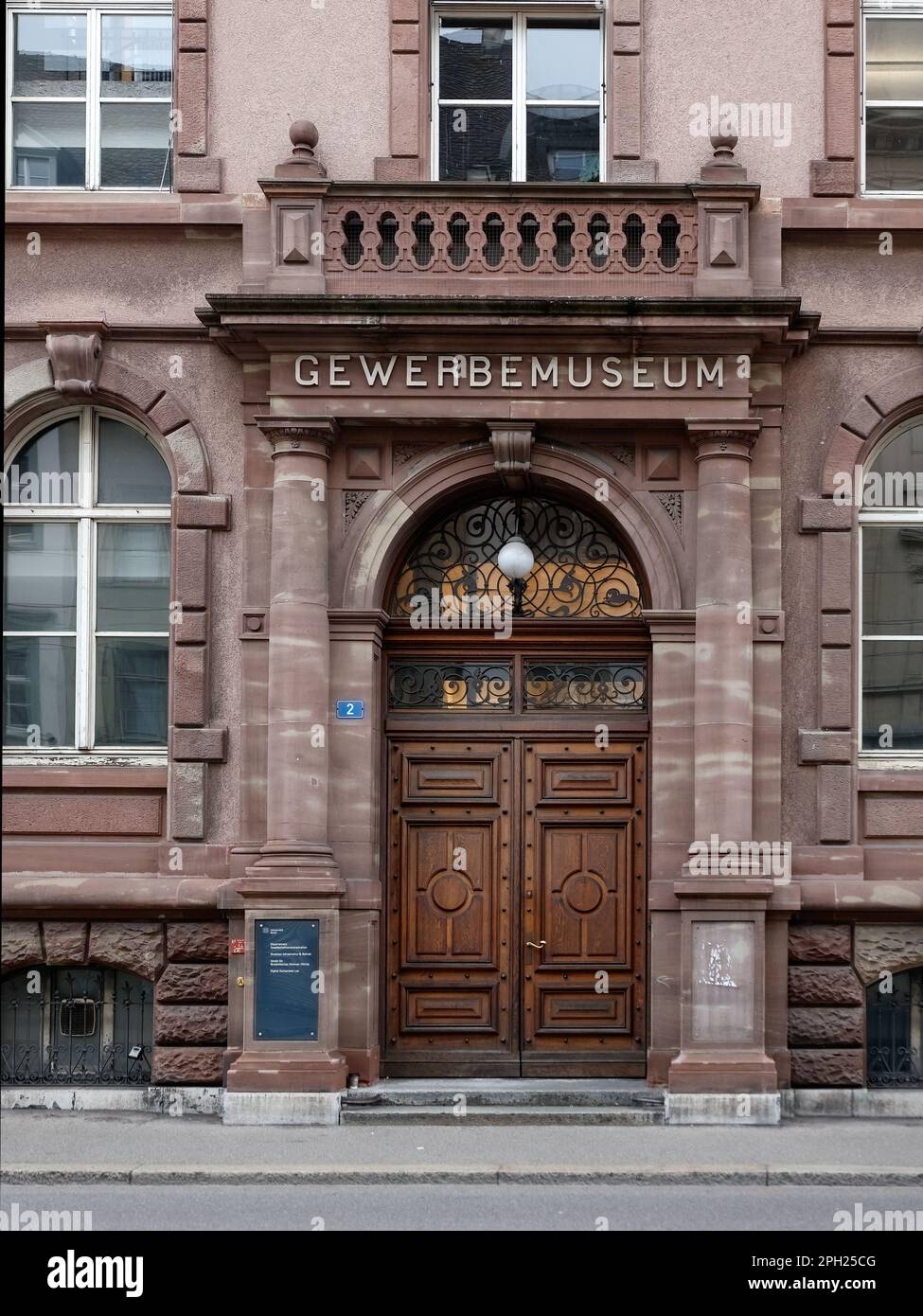 BASEL, SWITZERLAND - FEBRUARY 27, 2023: Entrance door and sign to the ...