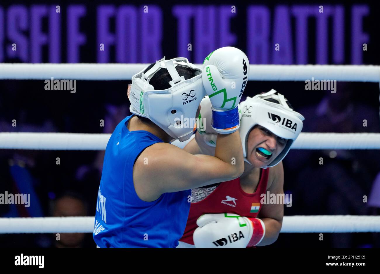 India's Sweety ,right, exchanges punches with China's Lina Wang during ...