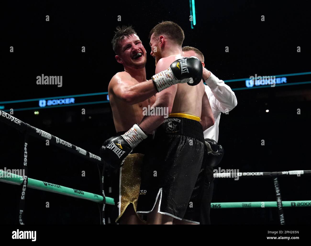 Rhys Edwards hugs Brian Phillips following his victory in the super ...